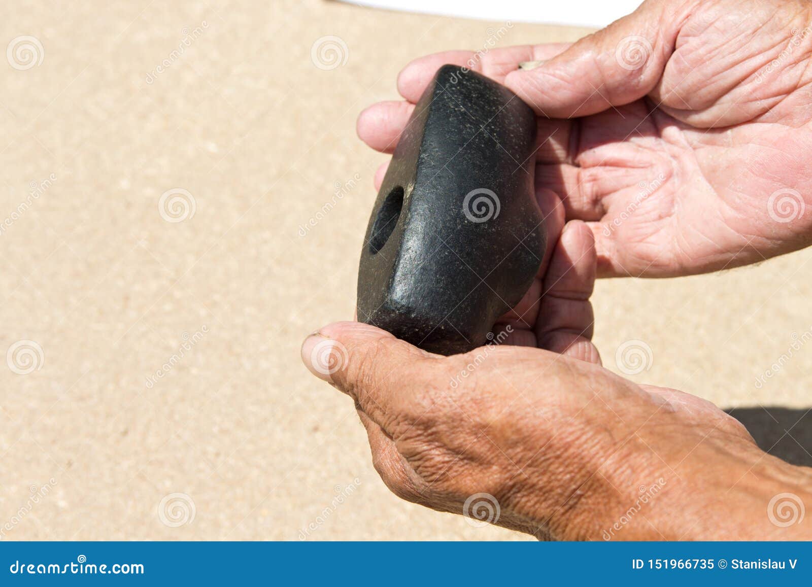 An Old Stone Hammer an Elder Man Holds in His Hands. Archaeology Stock ...