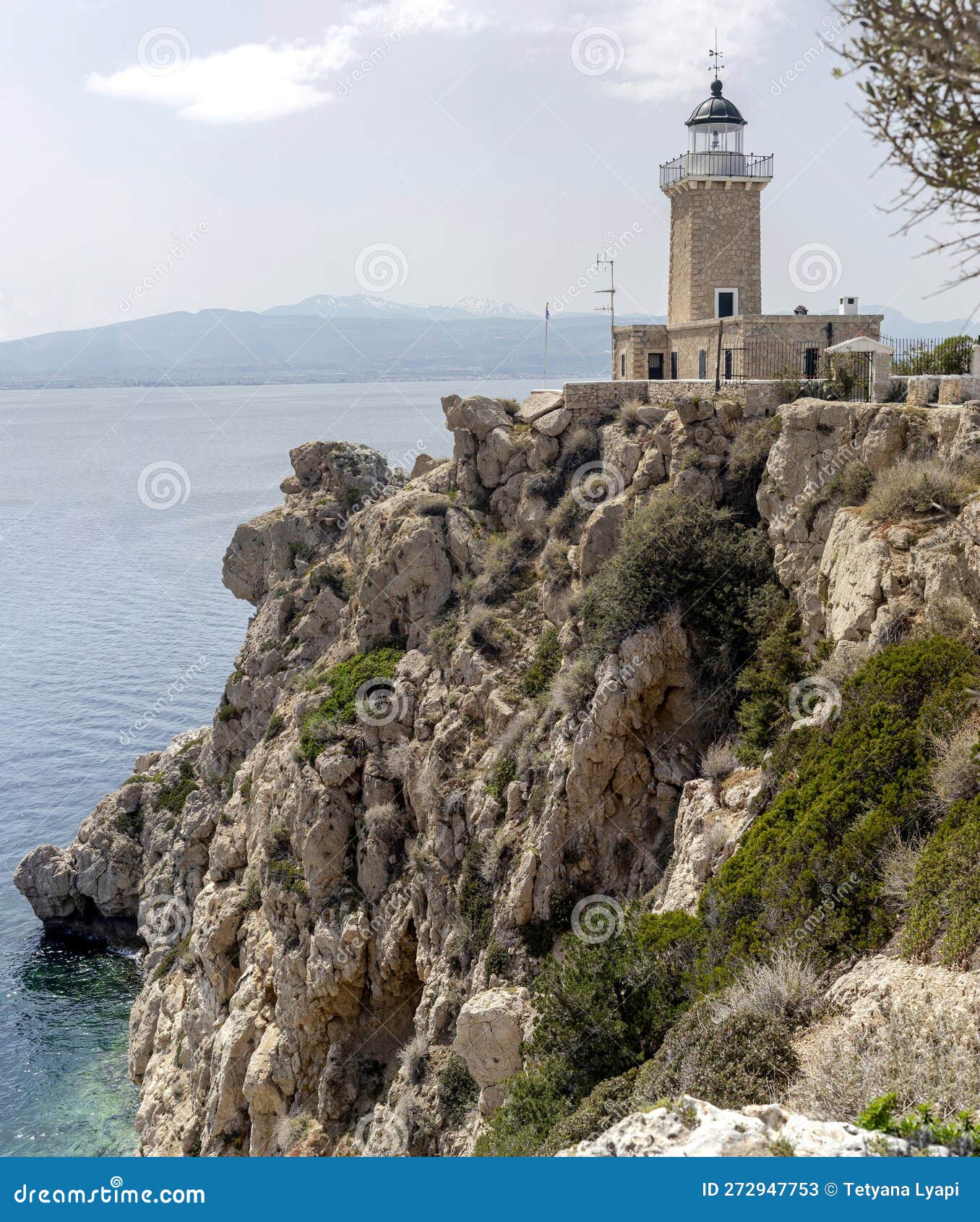 Old, Stone Lighthouse Against the Backdrop of the Sea and Mountains ...