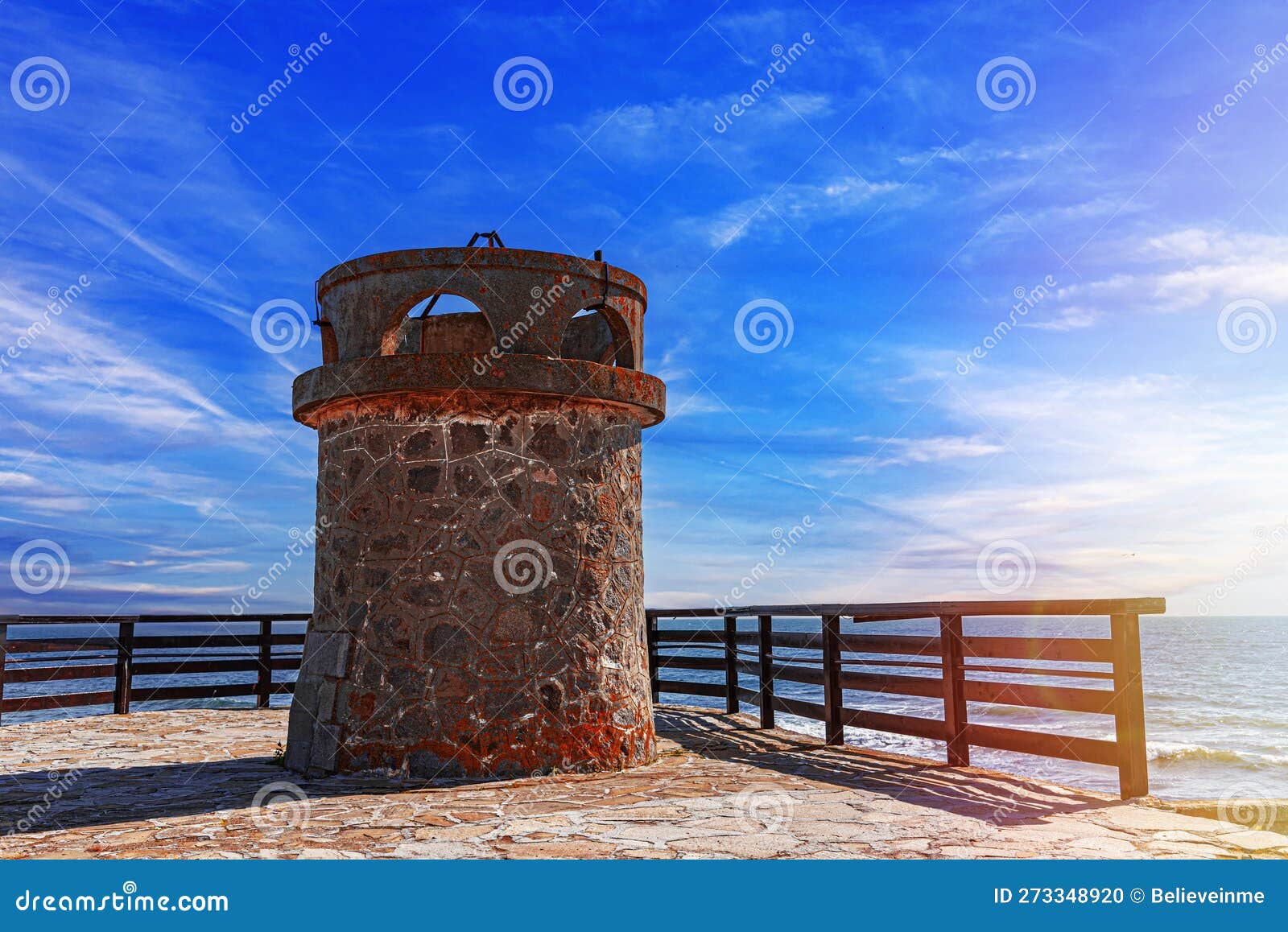 Old stone lighthouse stock photo. Image of beach, sunset - 273348920