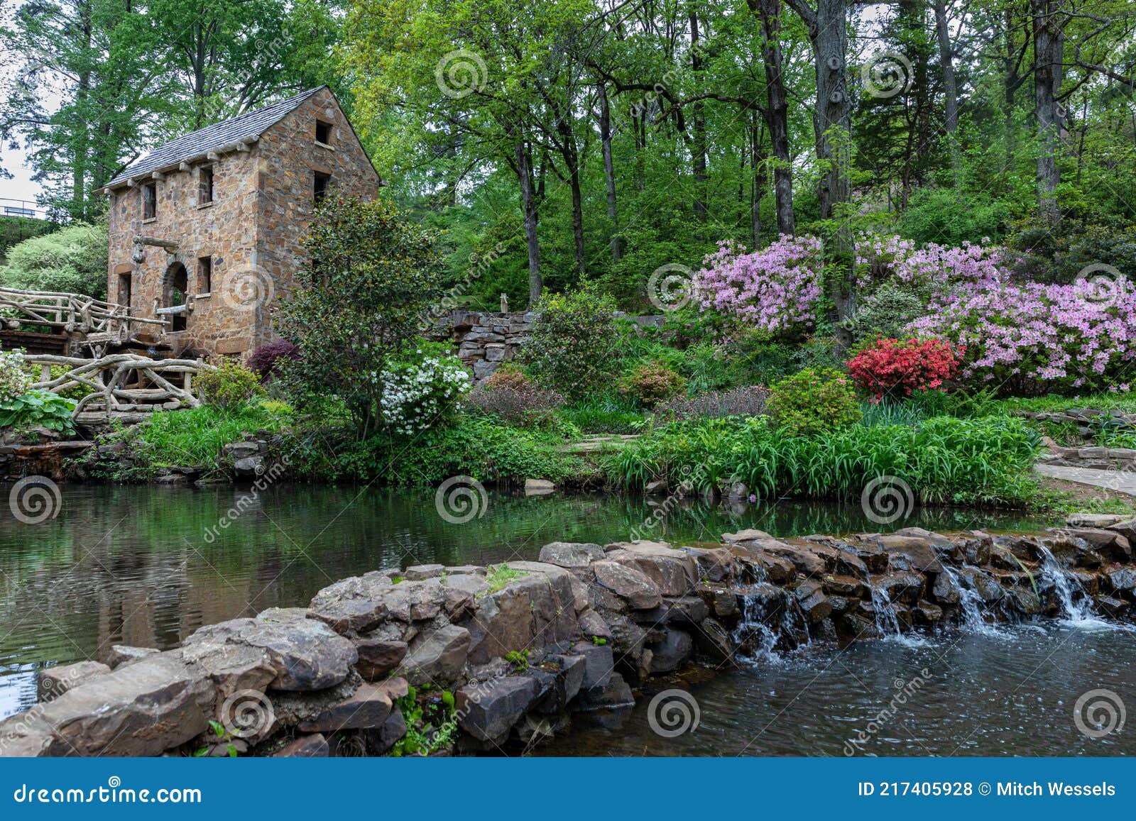 Old stone Mill in spring stock photo. Image of reflection - 217405928