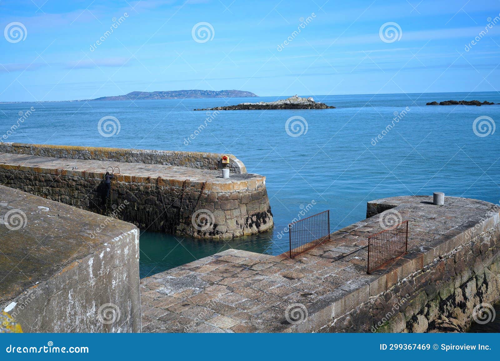 Old stone pier at Dalkey stock image. Image of view - 299367469