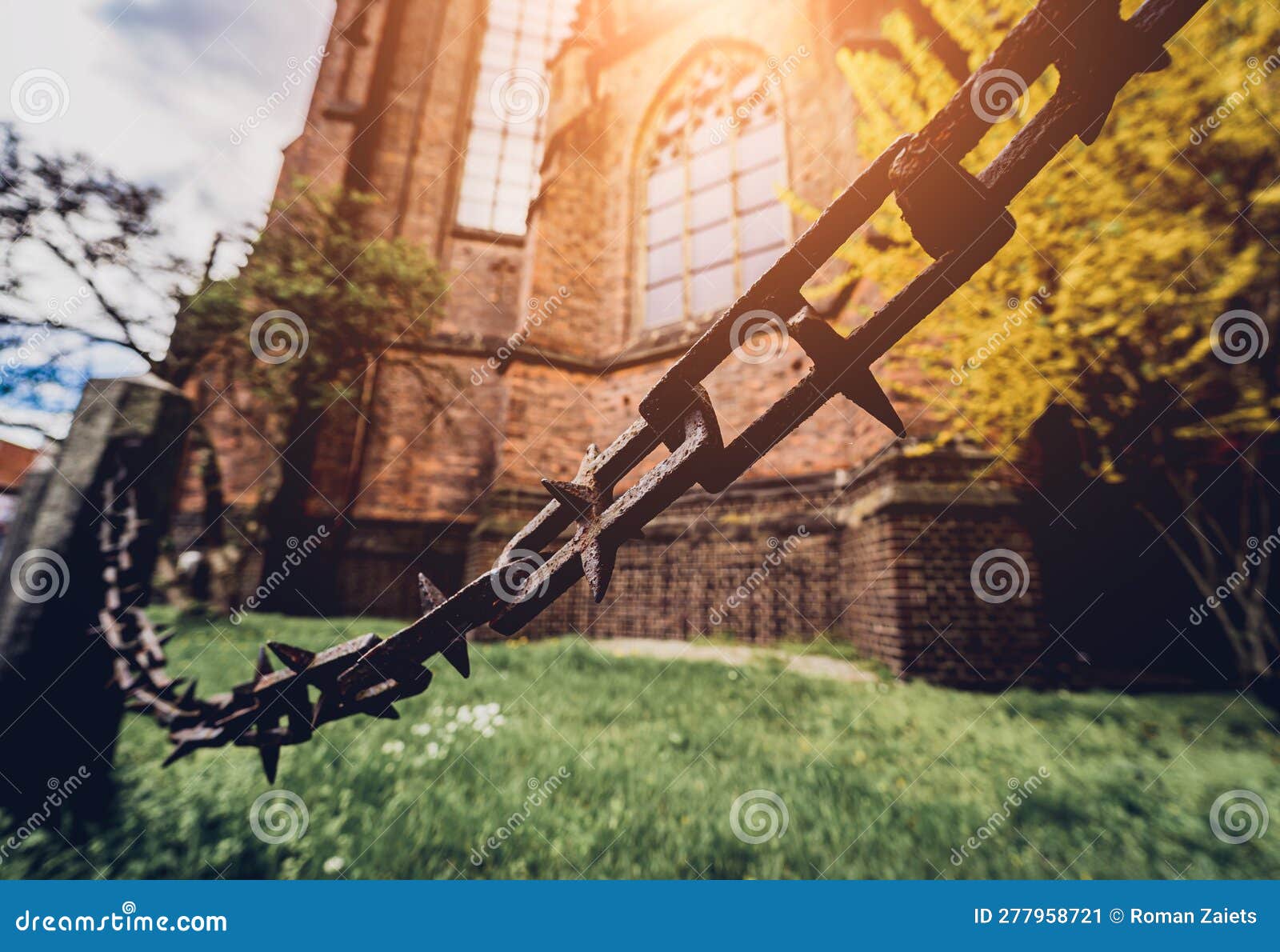 Old Stone Posts with Chains on a Background of Green Grass Stock Image ...