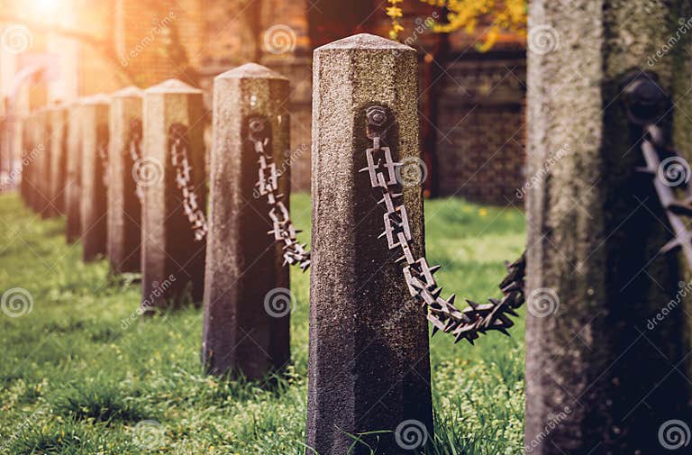 Old Stone Posts with Chains on a Background of Green Grass Stock Image ...