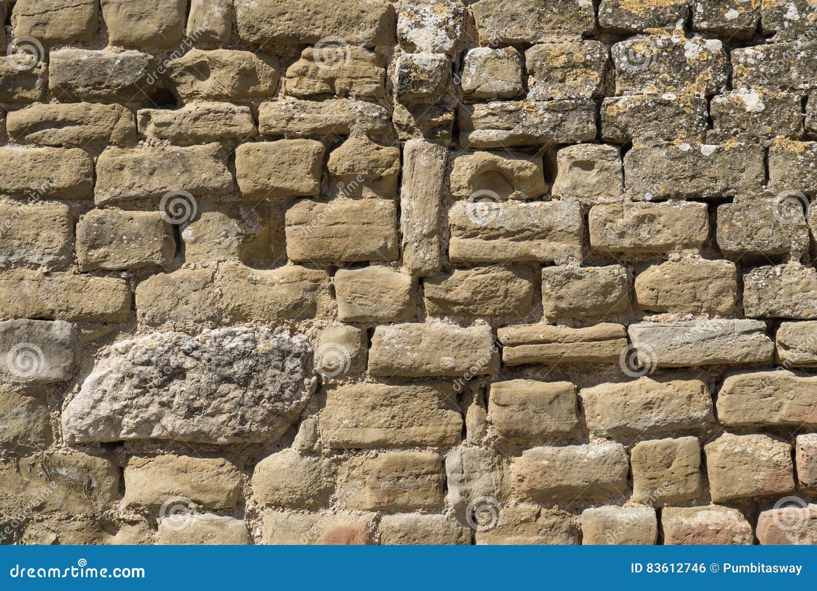 Old Stone Wall of a Castle Carved by Hand with More Modern Pieces in ...
