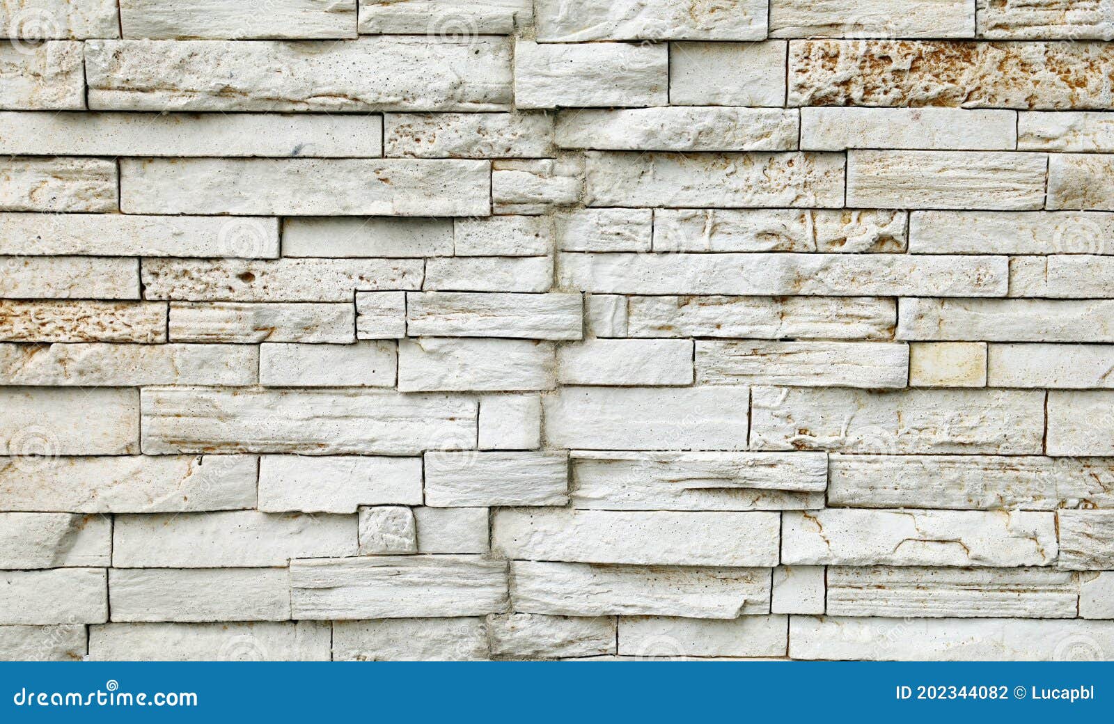 Old Stone Wall Cladding Made of Horizontal White Bricks with Brown ...
