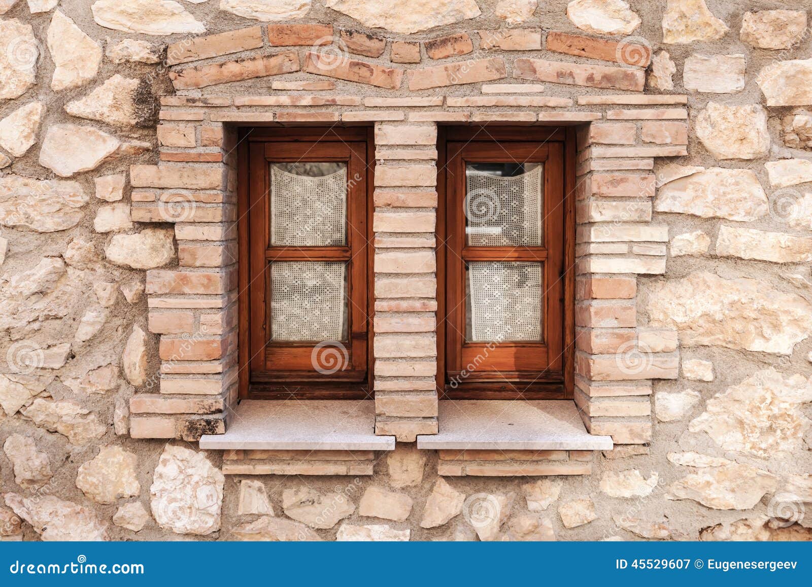 Old Stone Wall with Two Small Windows in Wooden Frames Stock Image ...