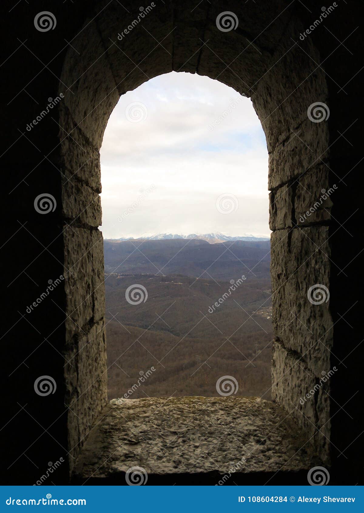 Old Stone Window in the Form of an Arch with a View of the Mountains ...