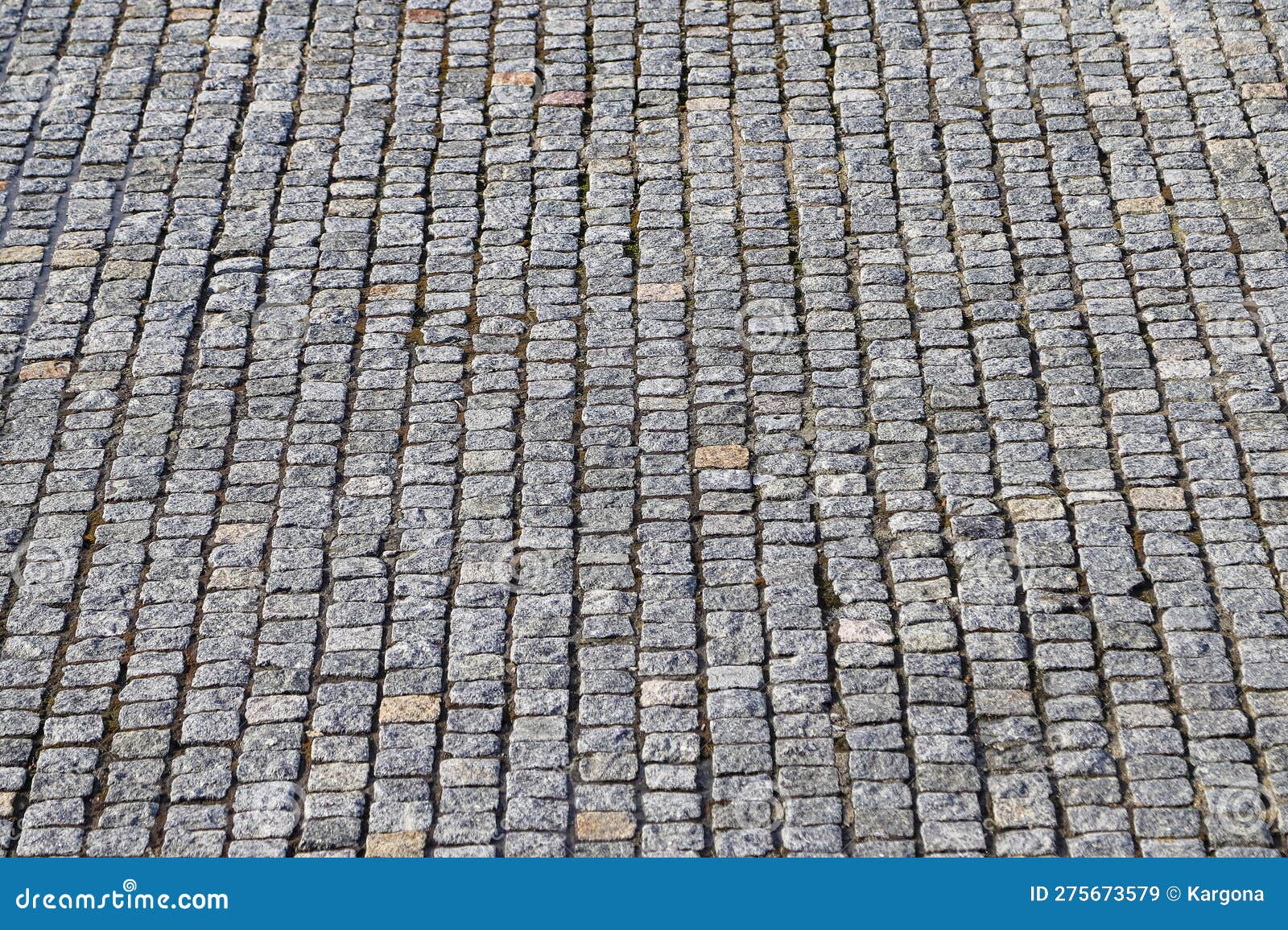 An Old Stoneblock Pavement Cobbled With Natural Stone Blocks With Gaps ...
