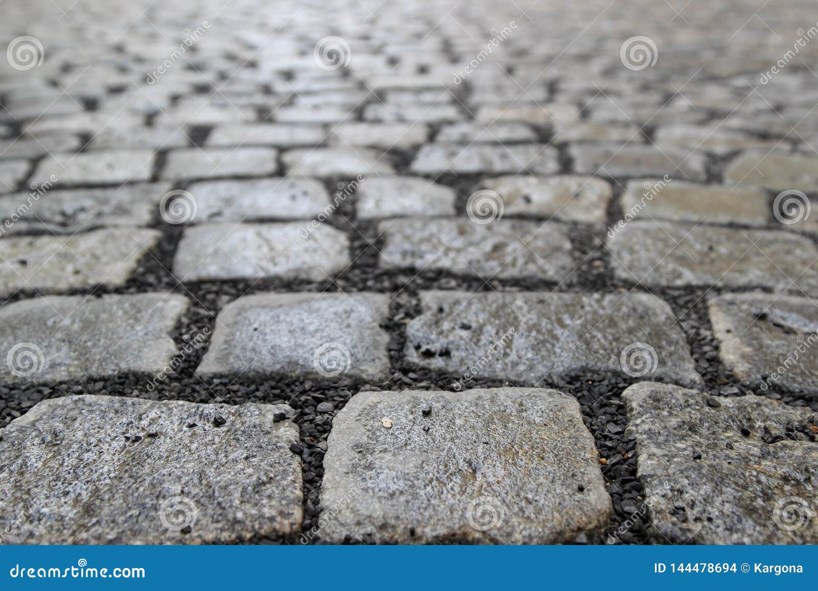 Old Stoneblock Pavement Cobbled With Square Granite Blocks With Grass ...