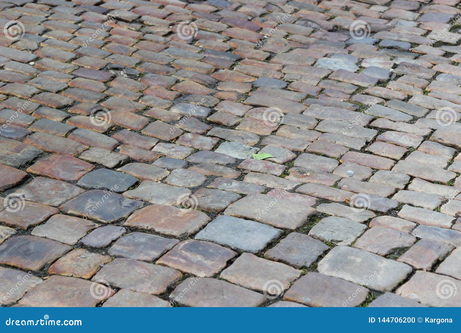 Old Stoneblock Pavement Cobbled With Square Granite Blocks With Grass ...