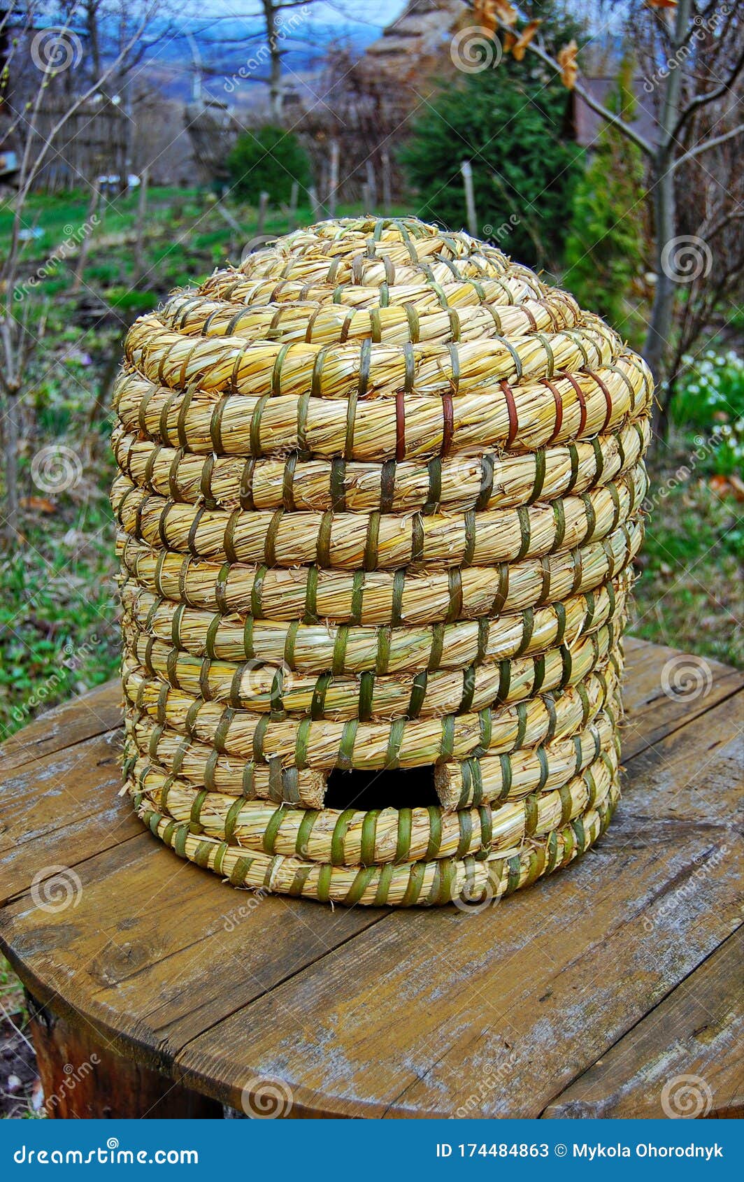 Old Straw Beehive Standing on a Wood Table Outdoors Stock Image - Image ...