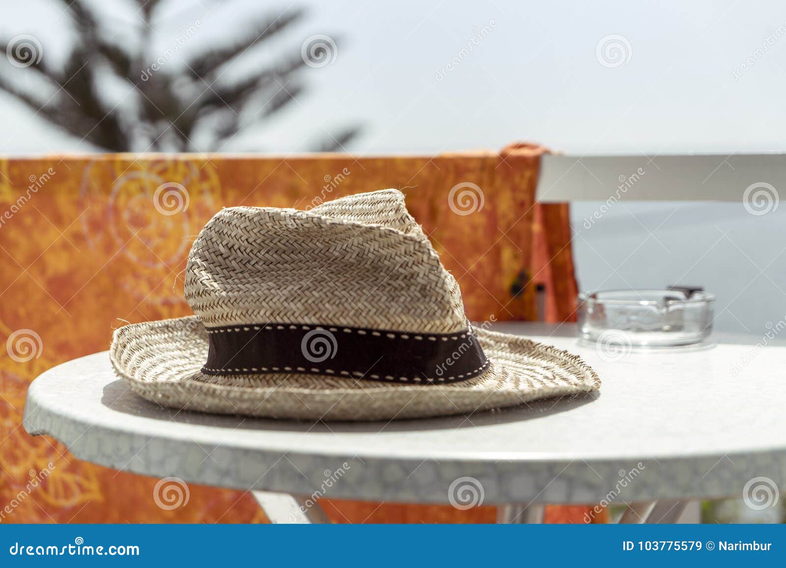 Old straw hat on a table stock image. Image of outdoor - 103775579