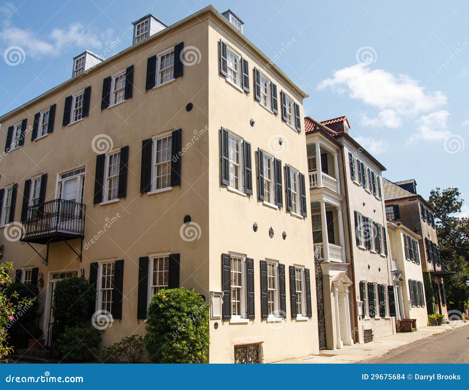 Old Stucco Building with Black Shutters Stock Photo - Image of ...