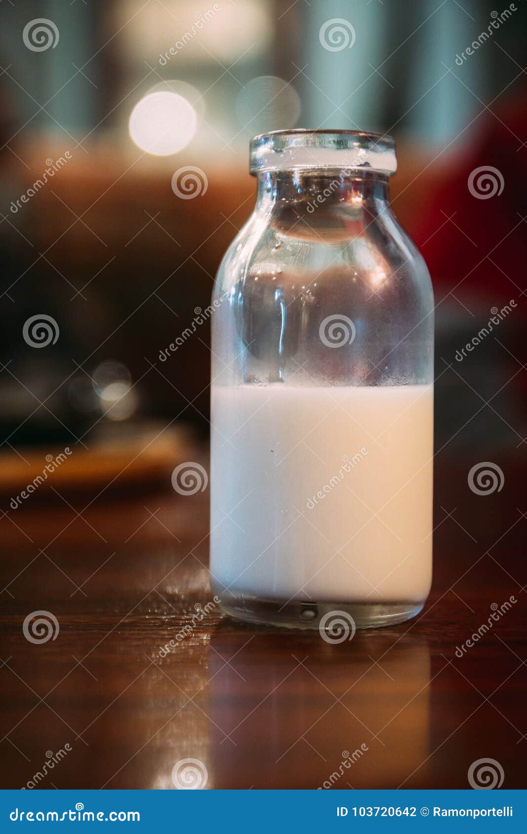Old Style Milk Cream Bottle on a Table, Portrait Orientation, Ha Stock ...