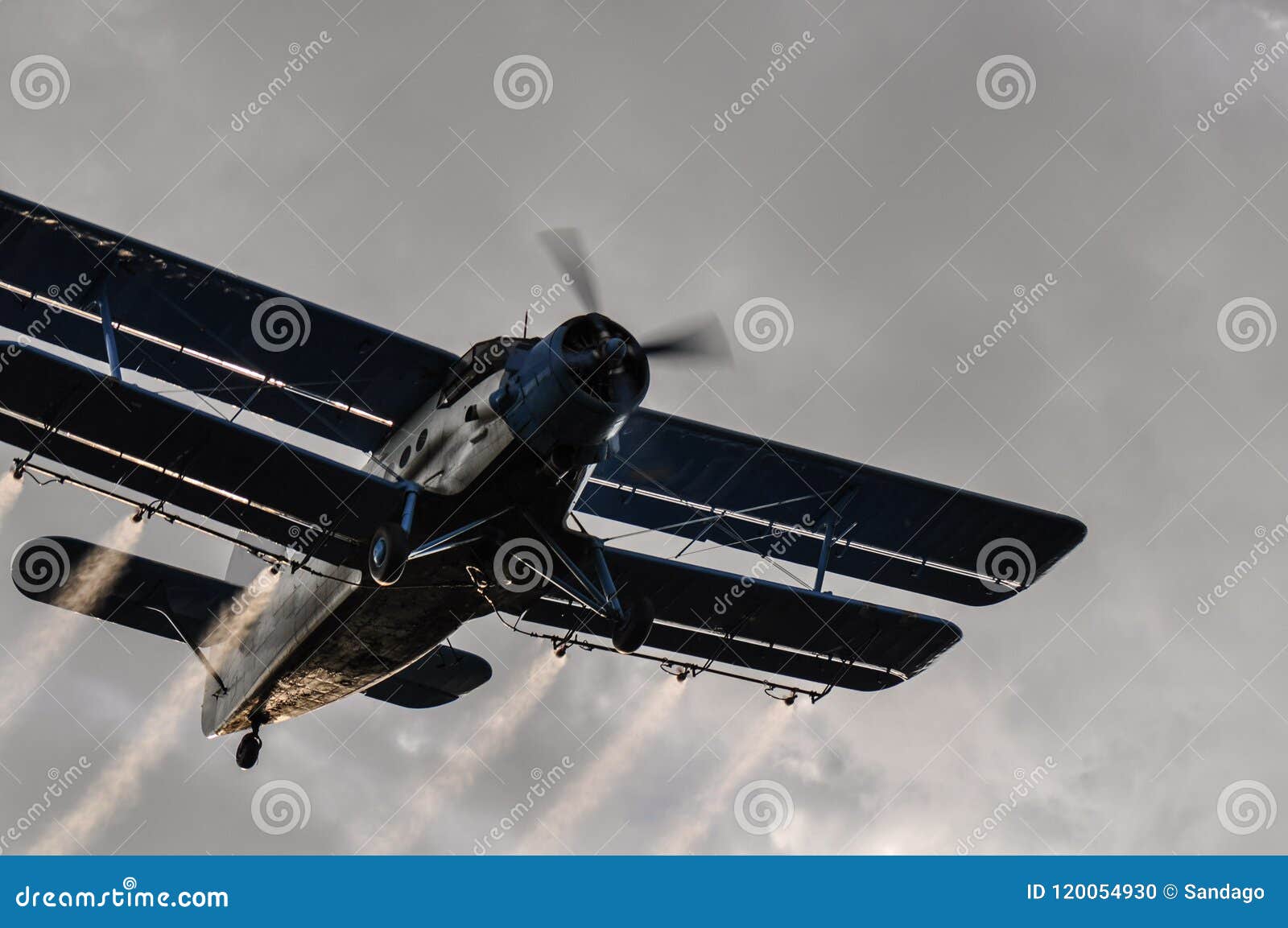 Old Plane Flying and Spraying the Crops Stock Photo - Image of gear ...