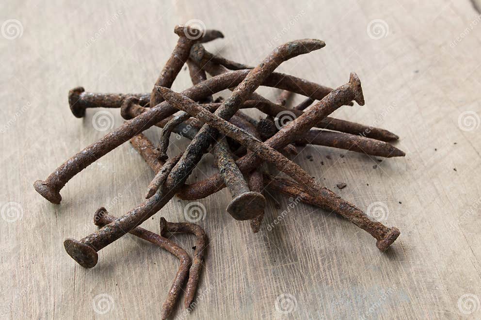 Old Tack with Rust on Wooden Stock Photo - Image of instrument, tool ...