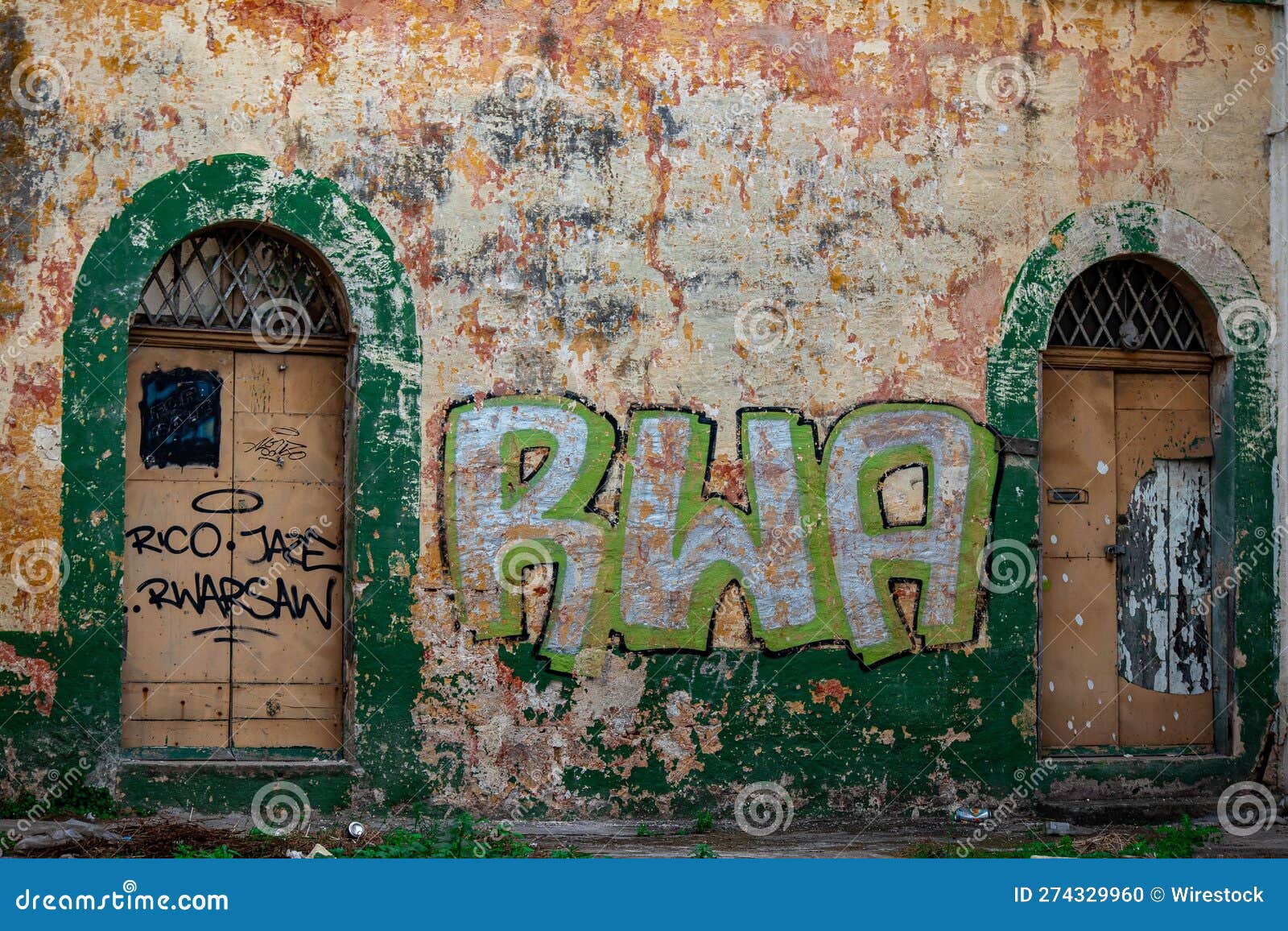 Old Tan-colored Building with Graffiti Adorning Its Walls. Editorial ...