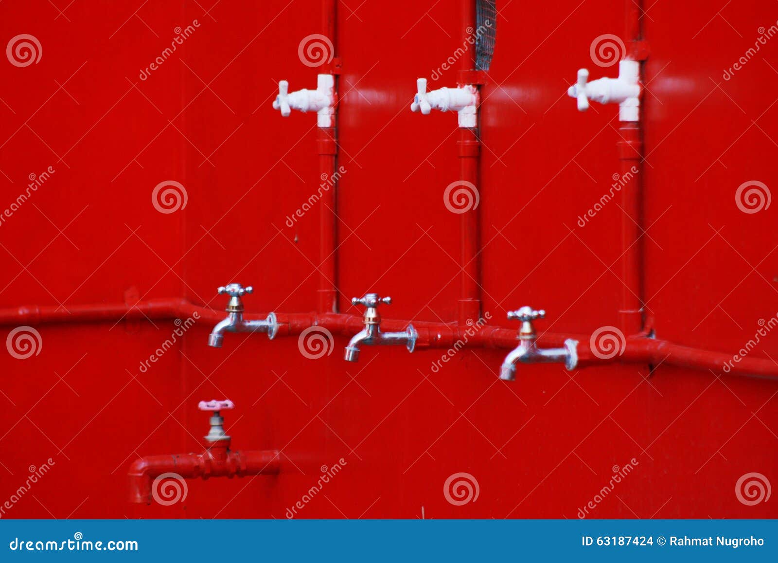 Old tap on a red stock photo. Image of flowing, faucet - 63187424