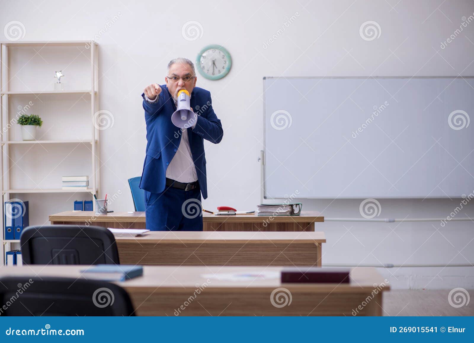 Old Male Teacher Holding Megaphone in the Classroom Stock Image - Image ...