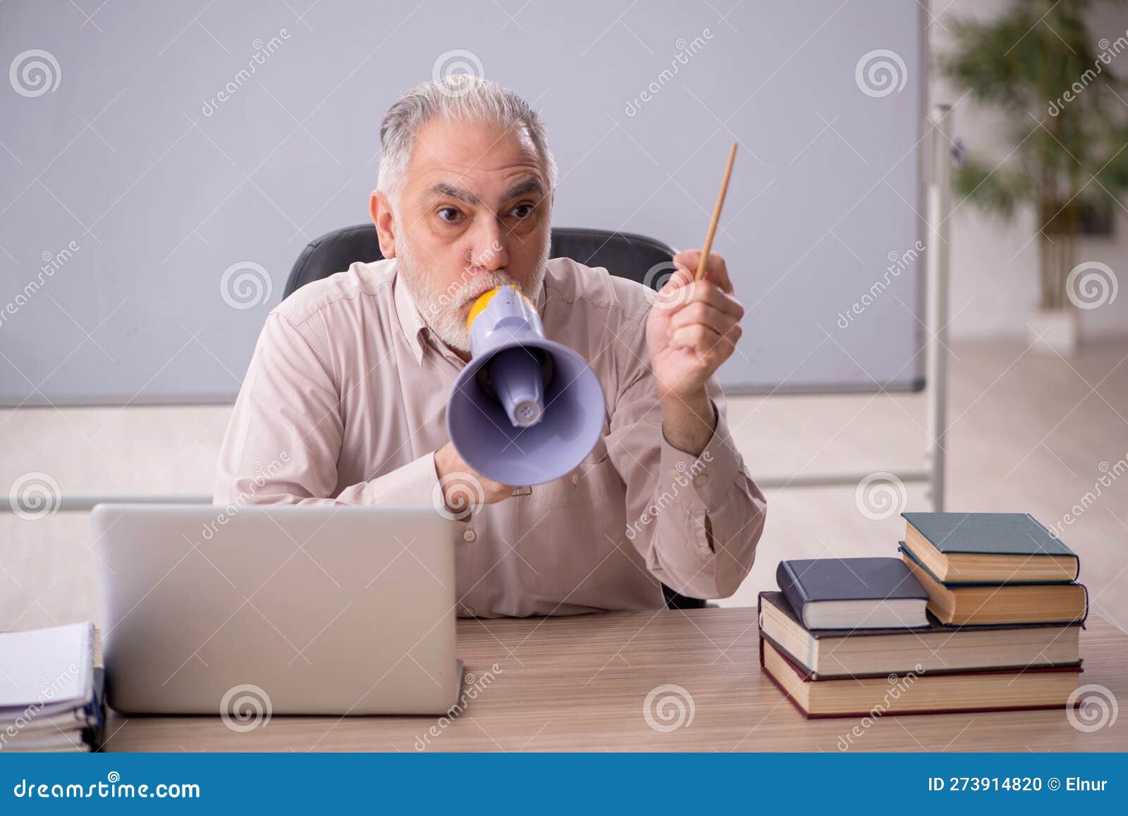 Old Male Teacher Holding Megaphone in the Classroom Stock Photo - Image ...