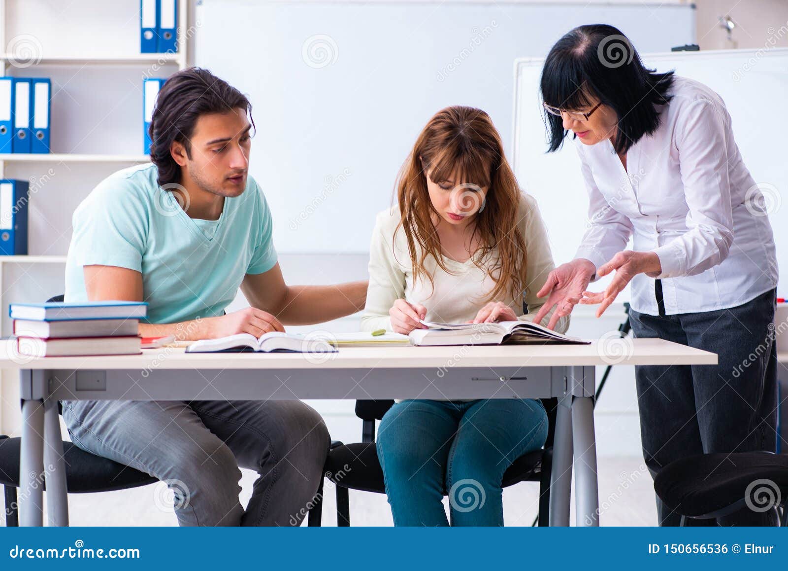 The Old Teacher and Students in the Classroom Stock Photo - Image of ...