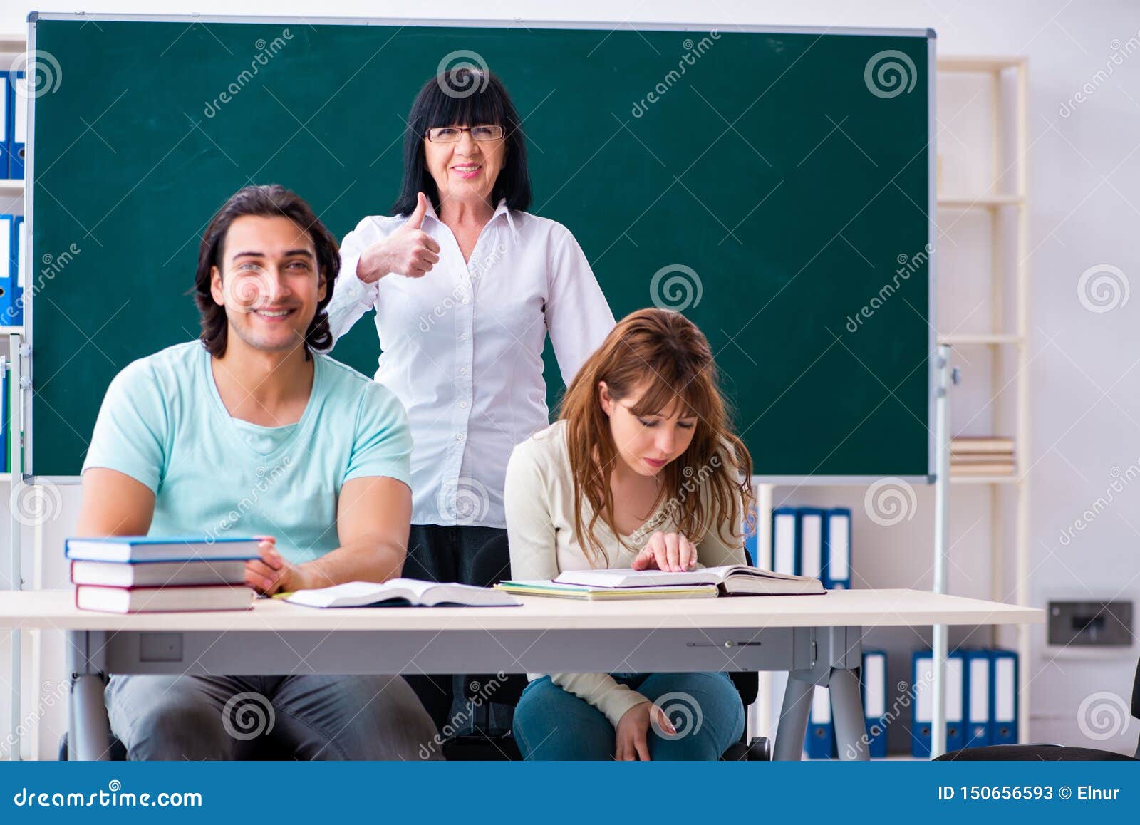 The Old Teacher and Students in the Classroom Stock Image - Image of ...