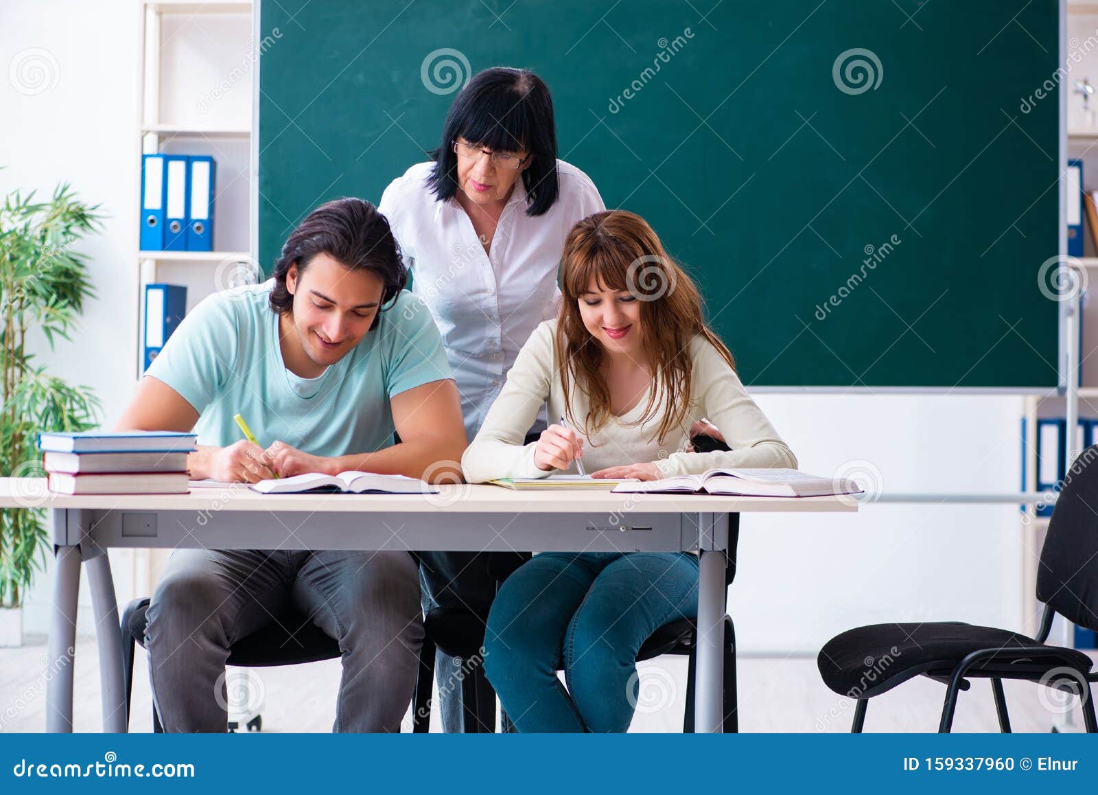Old Teacher and Students in the Classroom Stock Photo - Image of ...