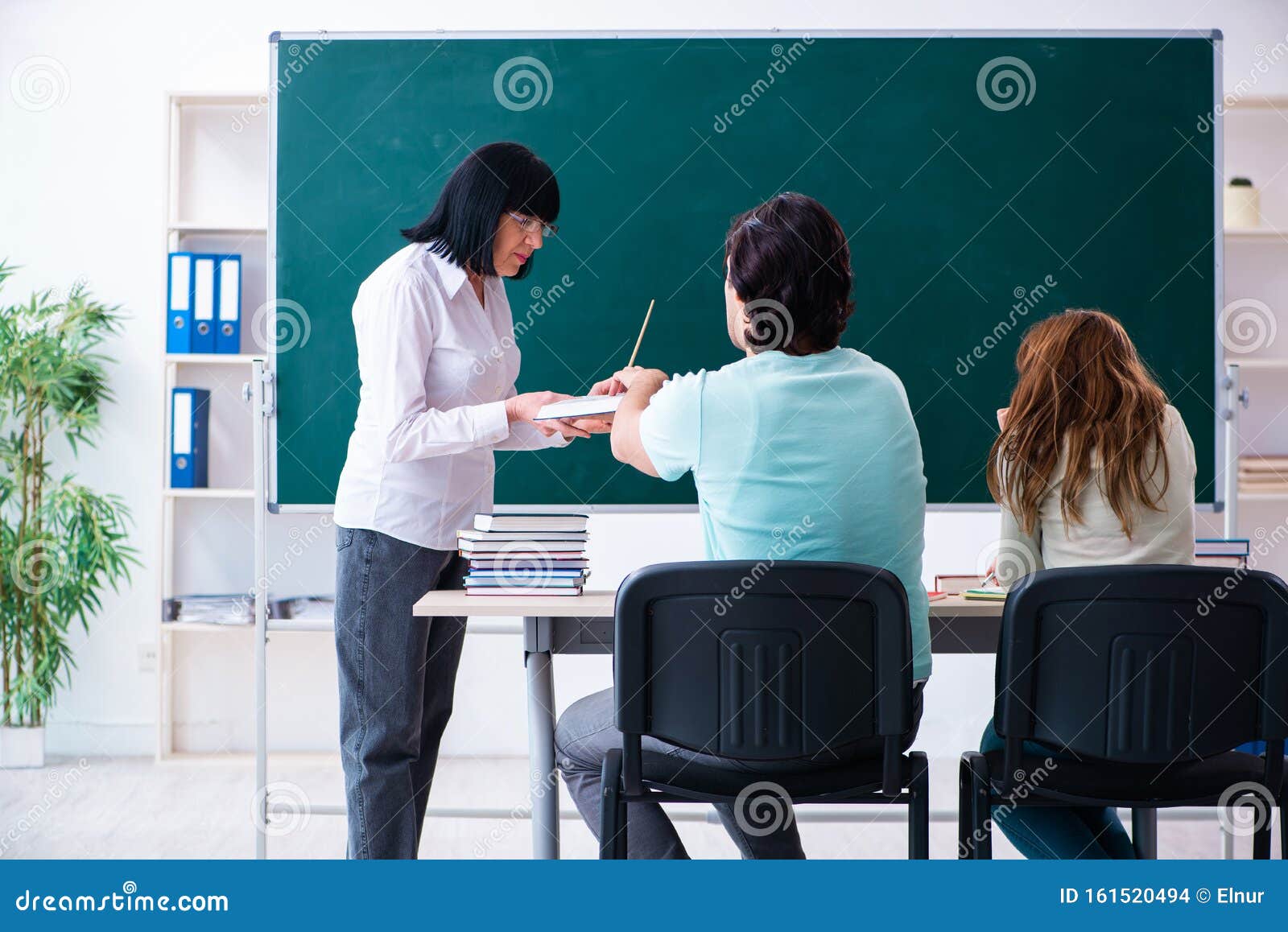 Old Teacher and Students in the Classroom Stock Photo - Image of ...