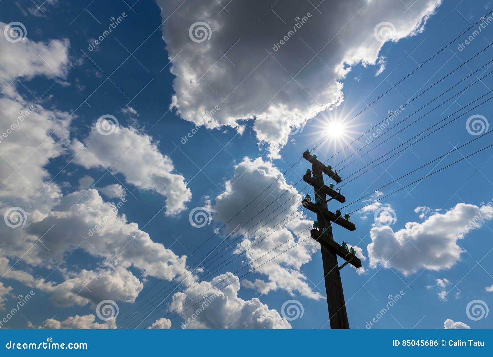 Old Telegraph Pole, Profiled on Sky with Cumulus Clouds, on a Bright ...