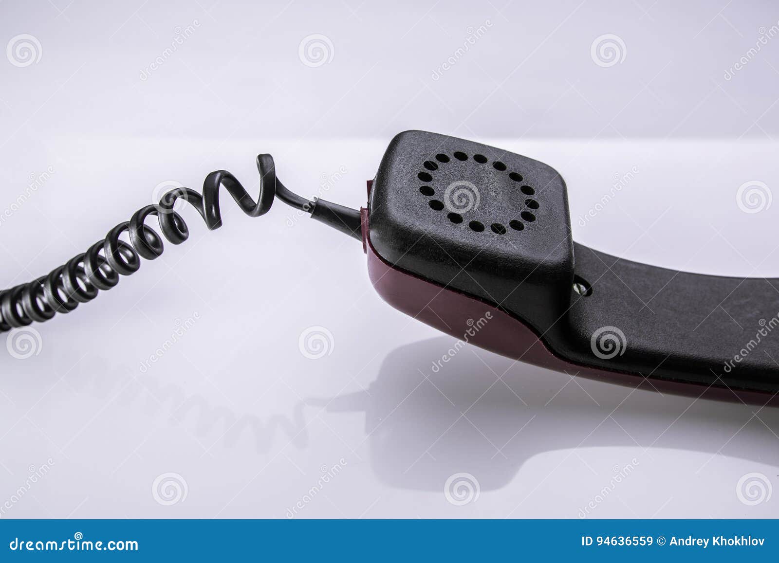 Old Telephone Handset and Cable on White Table with Reflection Stock ...