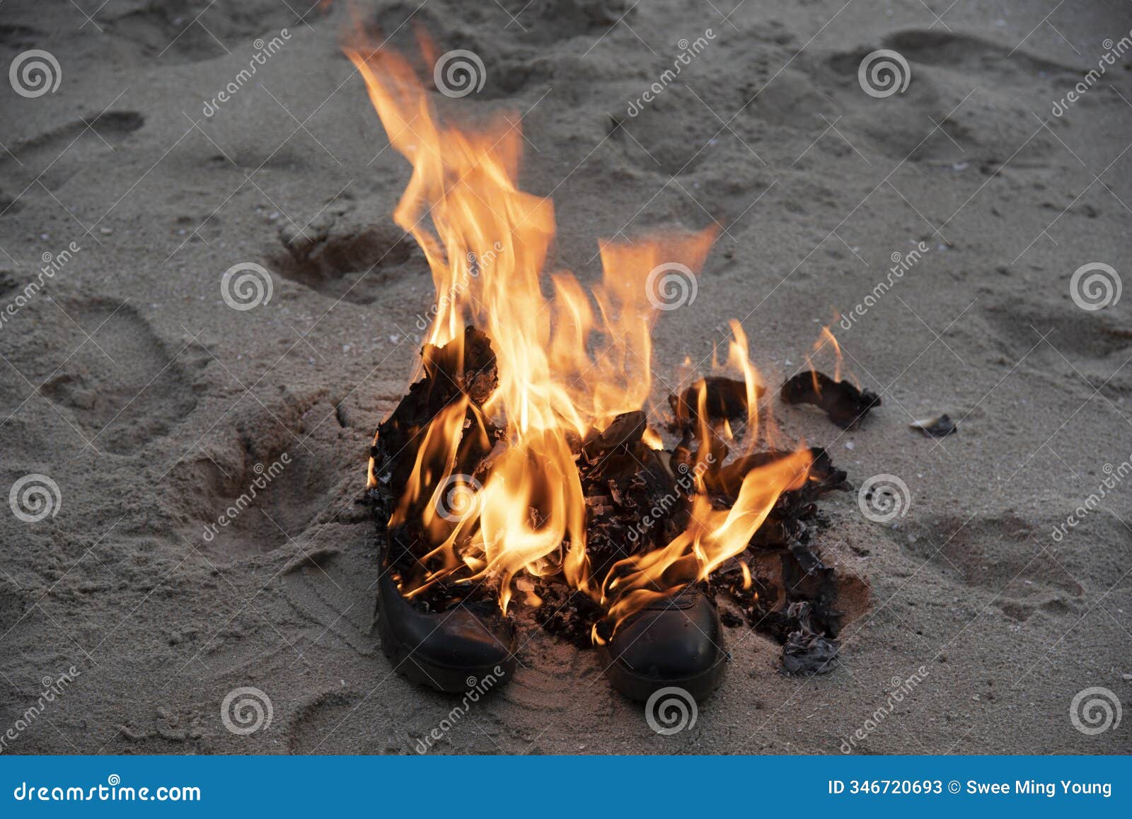 Old Thrown Away Leather Boot on Flame by the Beach. Stock Image - Image ...