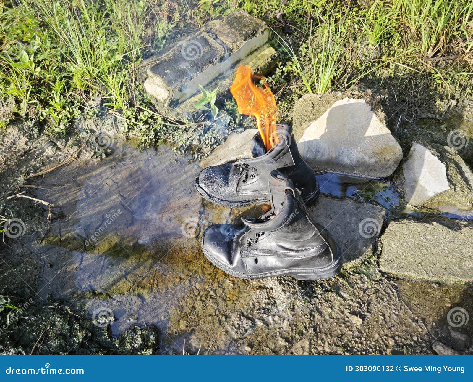 Old Thrown Away Leather Boot on Flame in the Farm. Stock Photo - Image ...