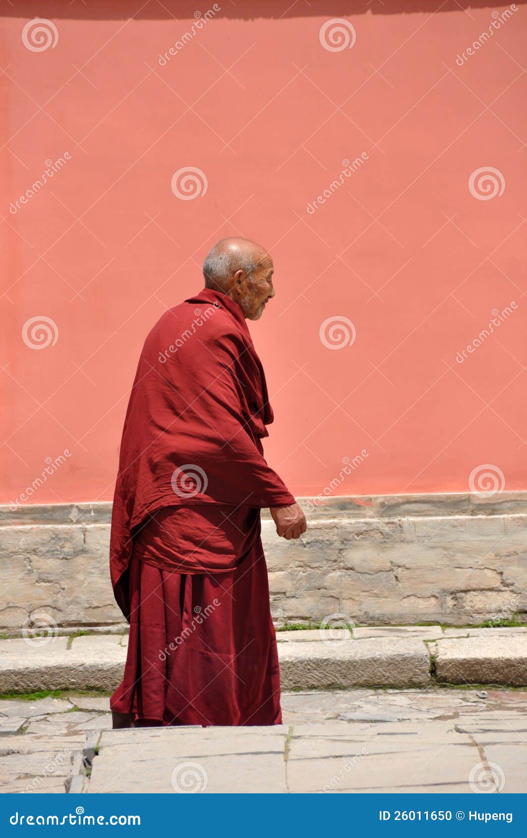 Tibetan Monk In Traditional Red Robe On The Bridge Over The Thimphu Chu ...