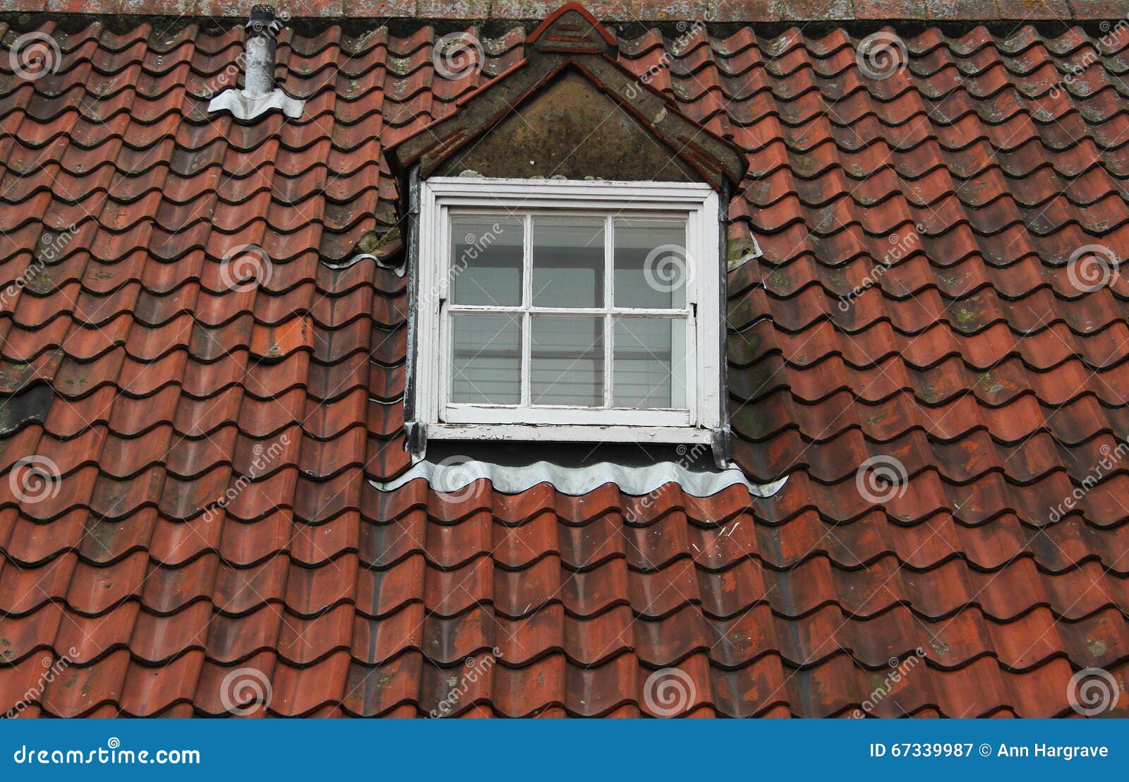 Old Tiled Roof With Chimneys And Dormers On Blue Sky Background. Stock ...
