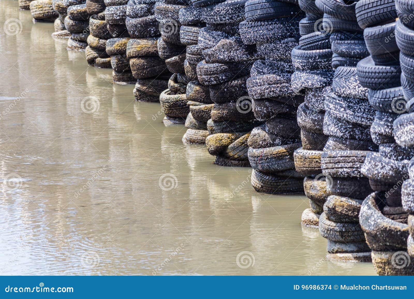 Old Tires Stacking for Break Water Stock Photo - Image of beach, wall ...