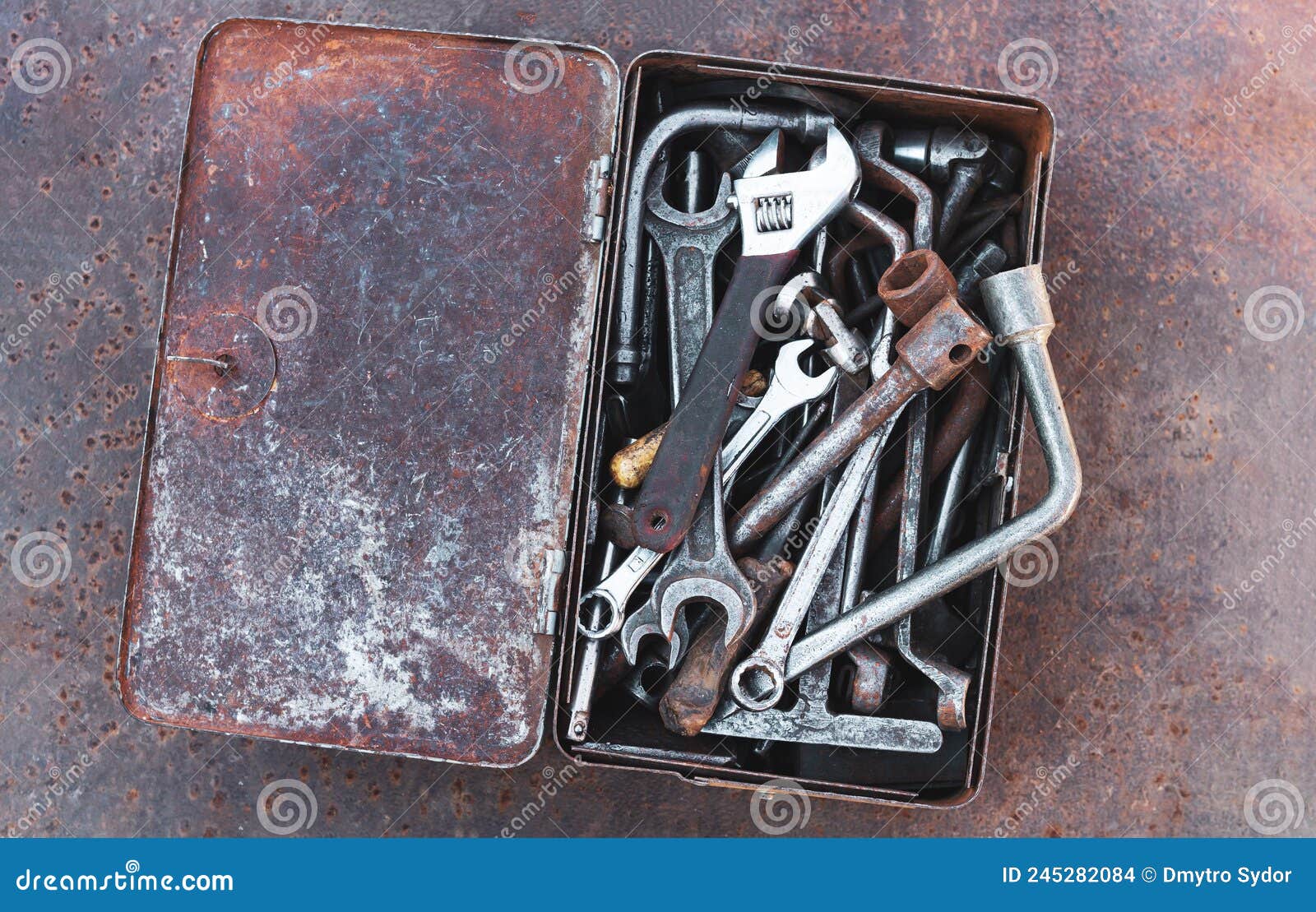 Old Toolbox of Dirty Hand Tools on Rusty Metal Table Stock Photo ...