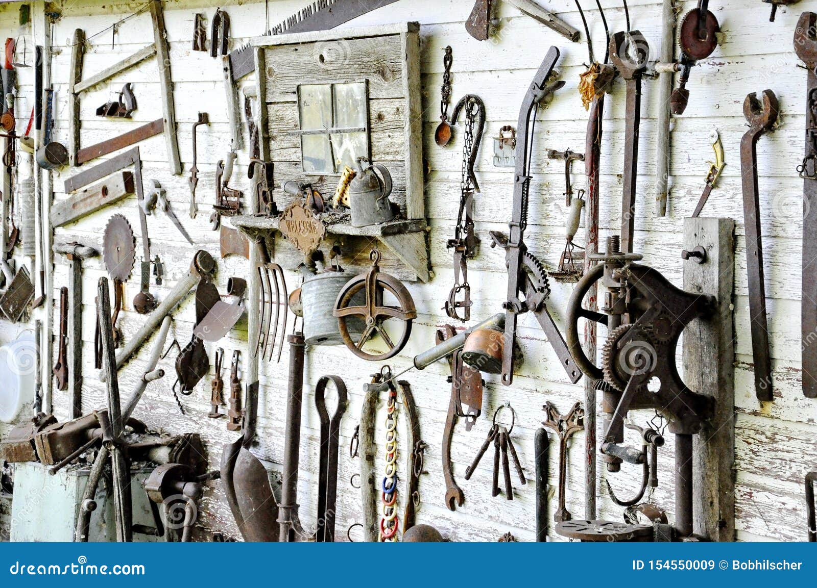Old Tools Hanging on a Wall Stock Image - Image of wall, antique: 154550009