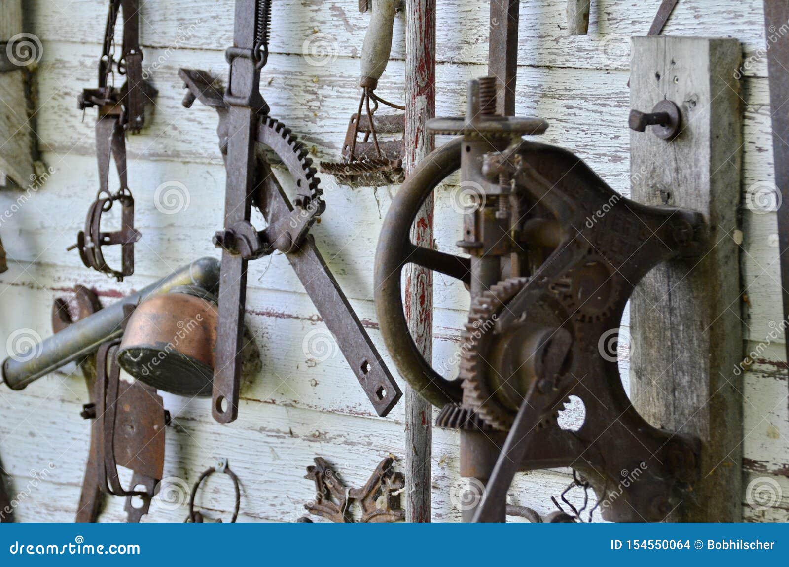 Old Tools Hanging on a Wall Stock Photo - Image of farming, wooden ...