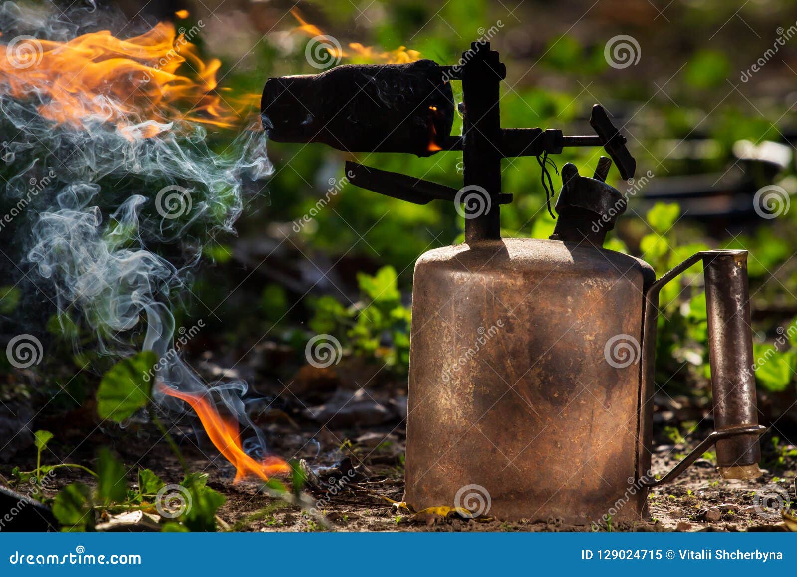 Old torch with a flame stock image. Image of burner - 129024715