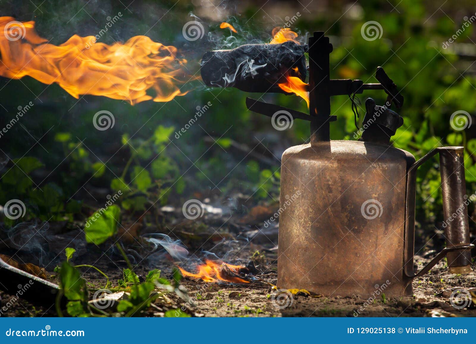 Old torch with a flame stock photo. Image of blowtorch - 129025138