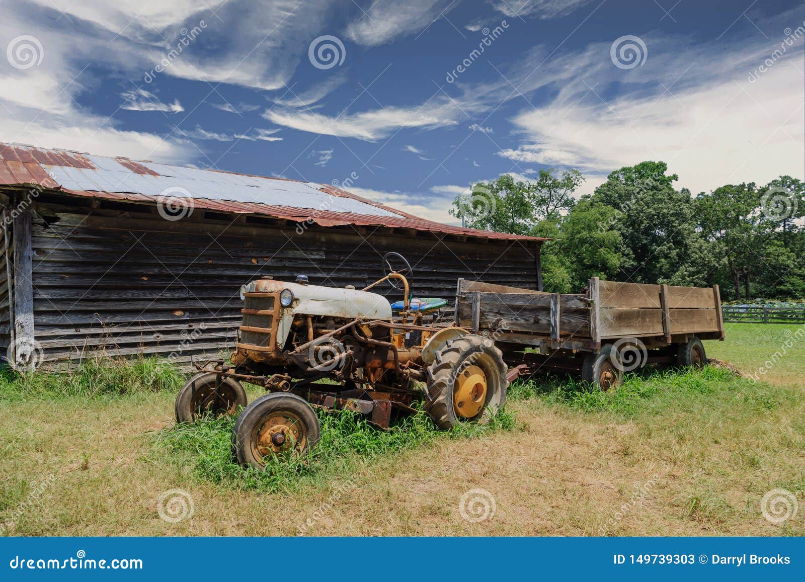 Old Tractor by Barn stock image. Image of machinery - 149739303