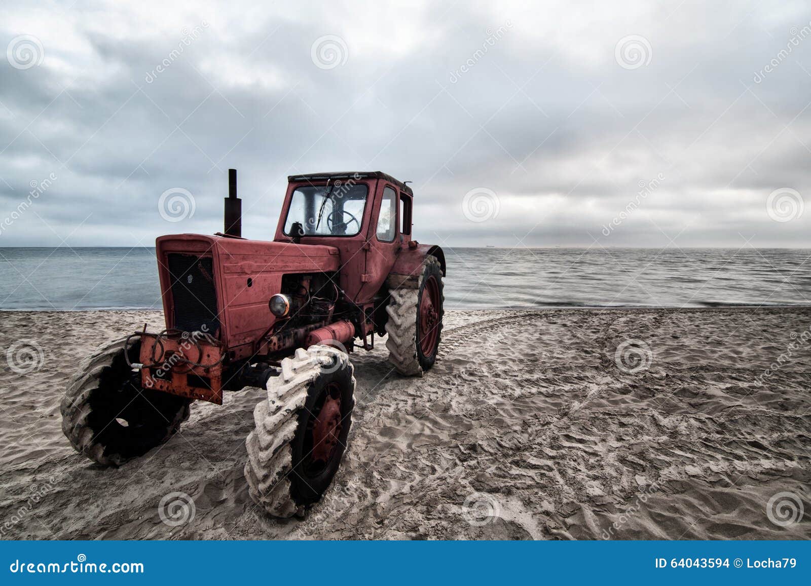 Old tractor on the beach stock photo. Image of europa - 64043594