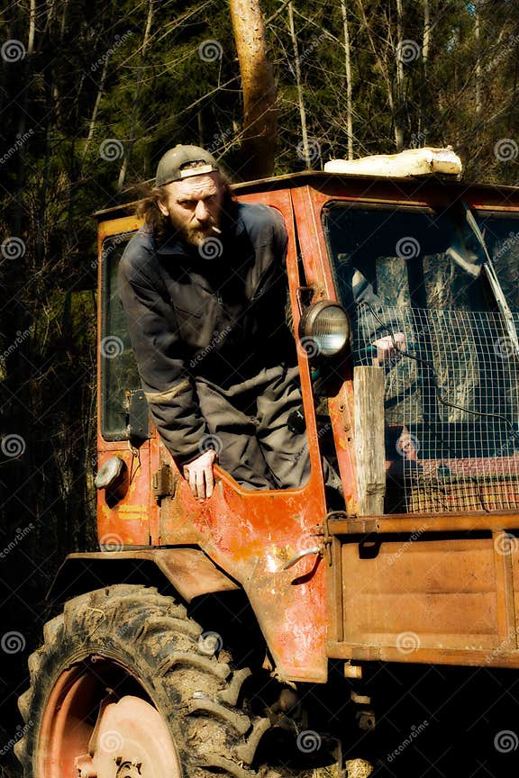 Old tractor and driver stock image. Image of male, farmer - 4889303
