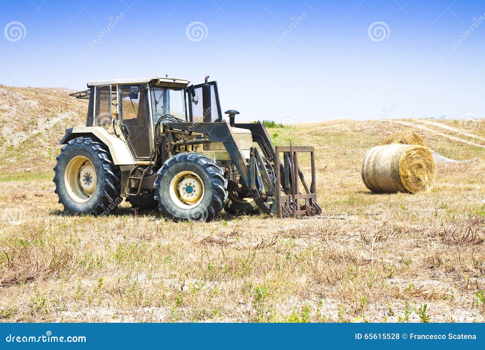 Old tractor in a hill stock photo. Image of isolated - 65615528