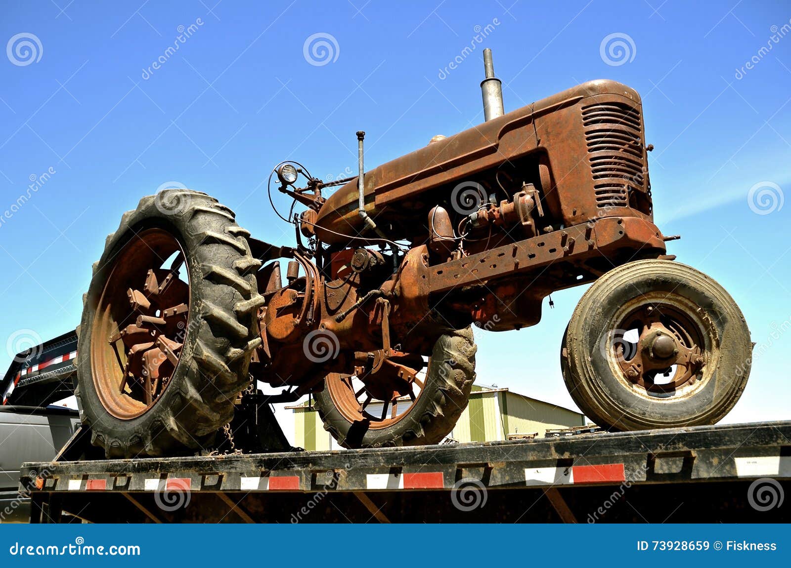 Old tractor lon a trailer stock image. Image of clunker - 73928659