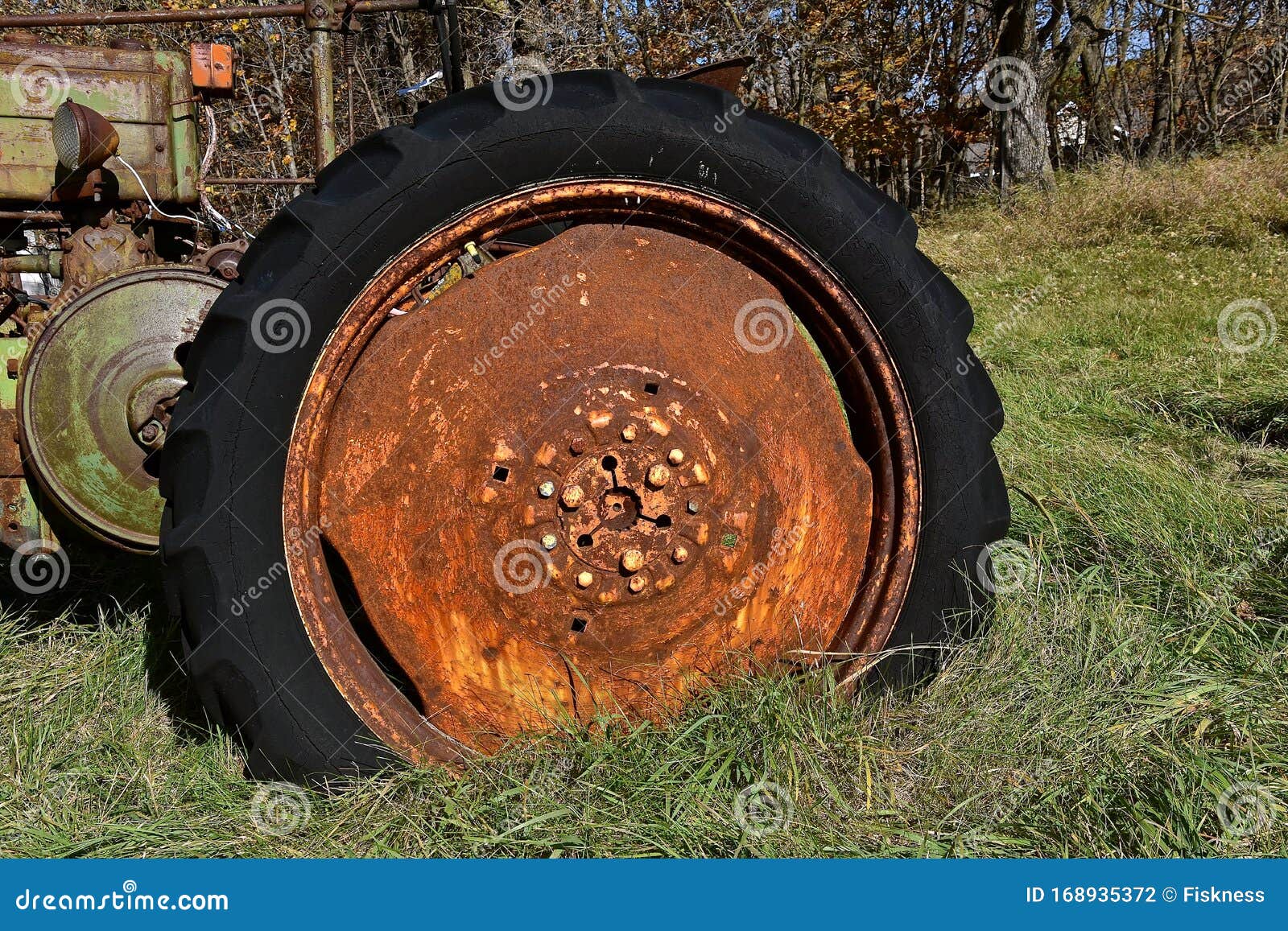 Old Tractor Tire and Wheel Full of Rust Stock Photo - Image of nuts ...