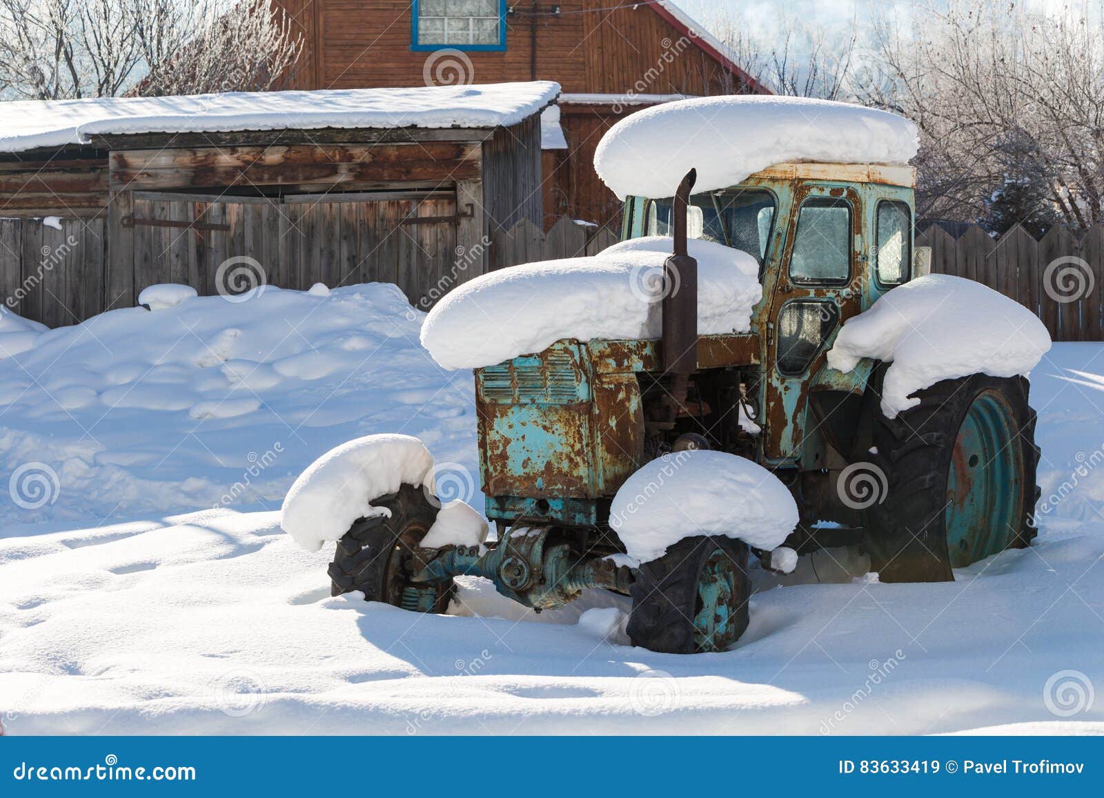 Old tractor under the snow stock image. Image of clean - 83633419