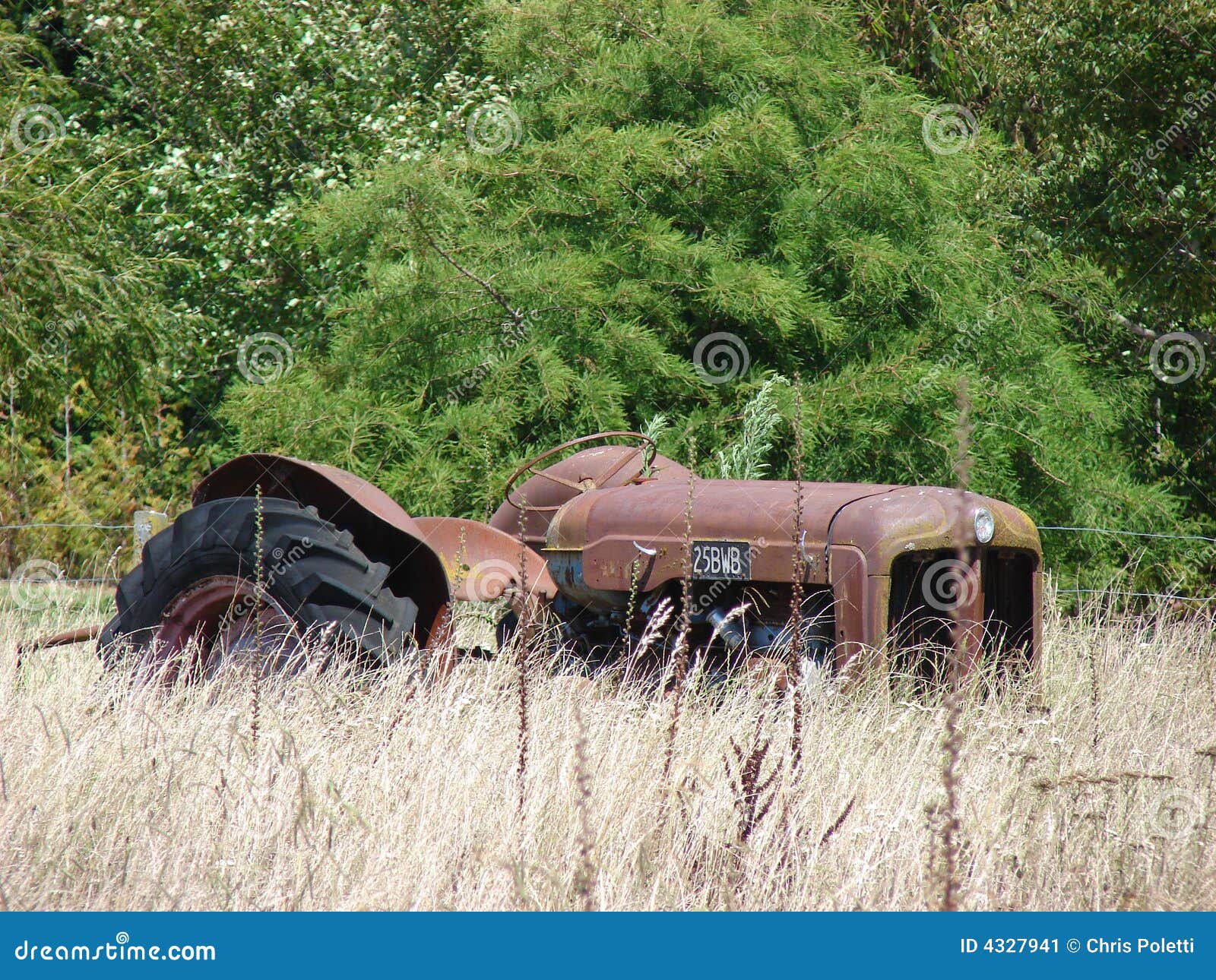 Old Tractor in Very Long Dry Grass Stock Image - Image of weathered ...