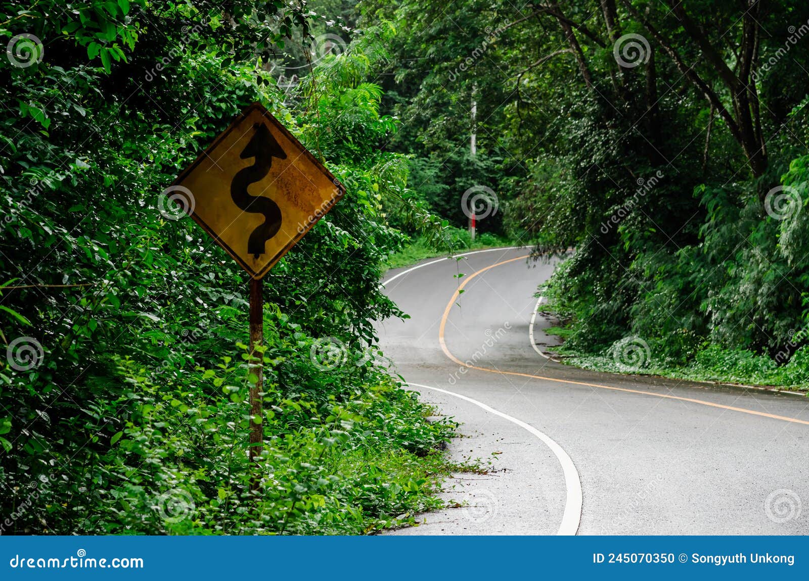 Old Traffic Sign Placed beside Along the Messy Road Stock Photo - Image ...