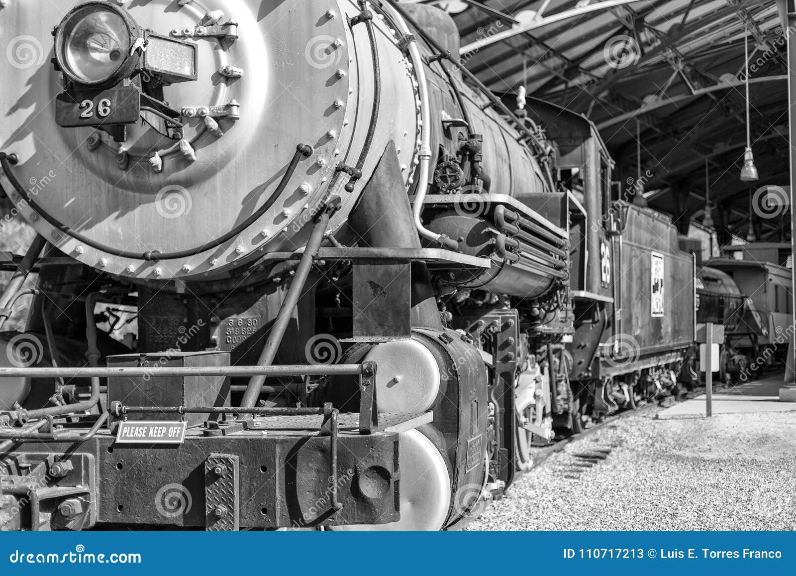 A Train With Red And White Locomotive Arriving To City Station ...